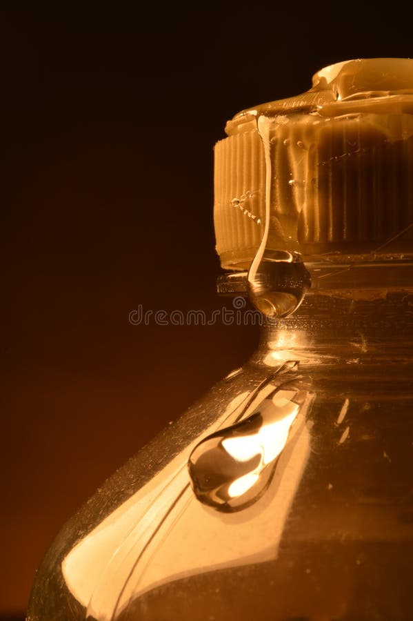 Squeeze Bottle Overflowing with Drips Stock Image - Image of gooey ...