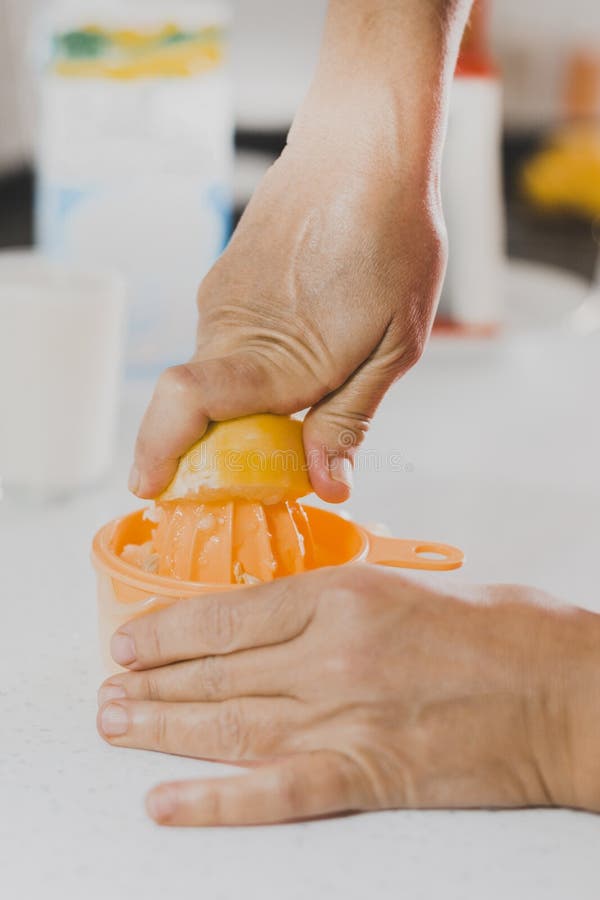 Squeeze Lemon by Hand with Lemon Juicer Stock Image - Image of ...