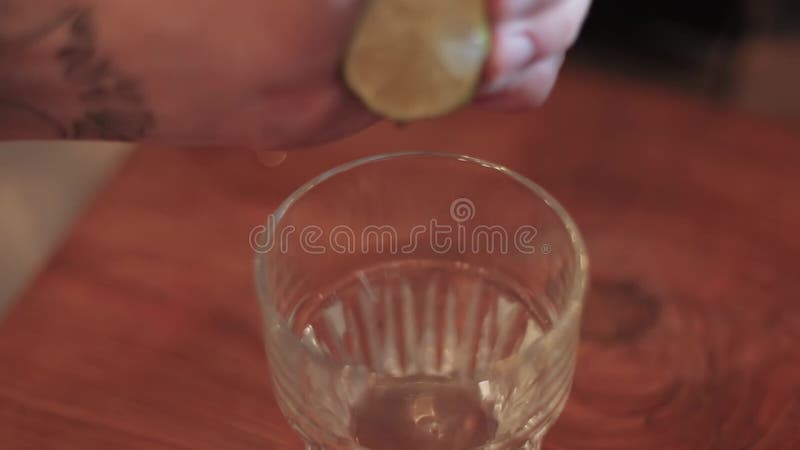 Squeeze Lemon Juice into a Glass. Close Up Stock Video - Video of chef ...