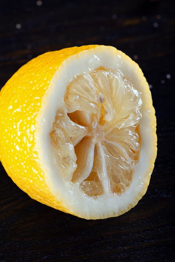 Squeezed Half Lemon on a Dark Table Stock Image - Image of fresh, pulp ...