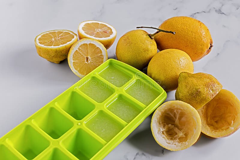 Squeezed Lemon Juice in Ice Cube Container Stock Photo - Image of ...
