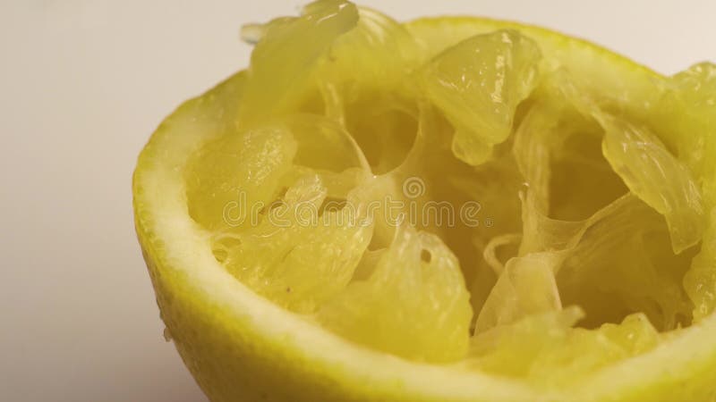 Squeezed Lemon Lies on a White Table. the White Table is Spinning, or ...