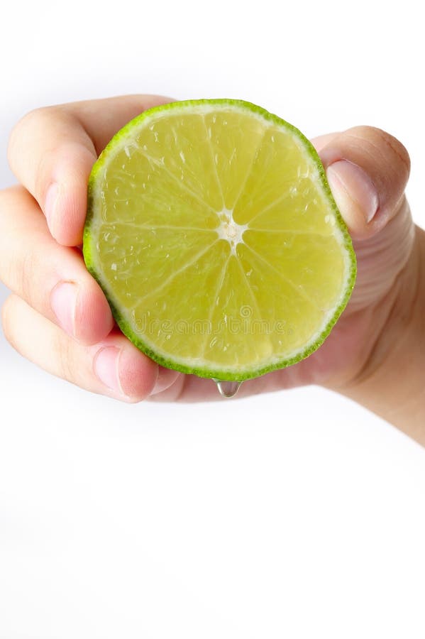 Squeezing a lime stock image. Image of flow, alcohol - 11884543