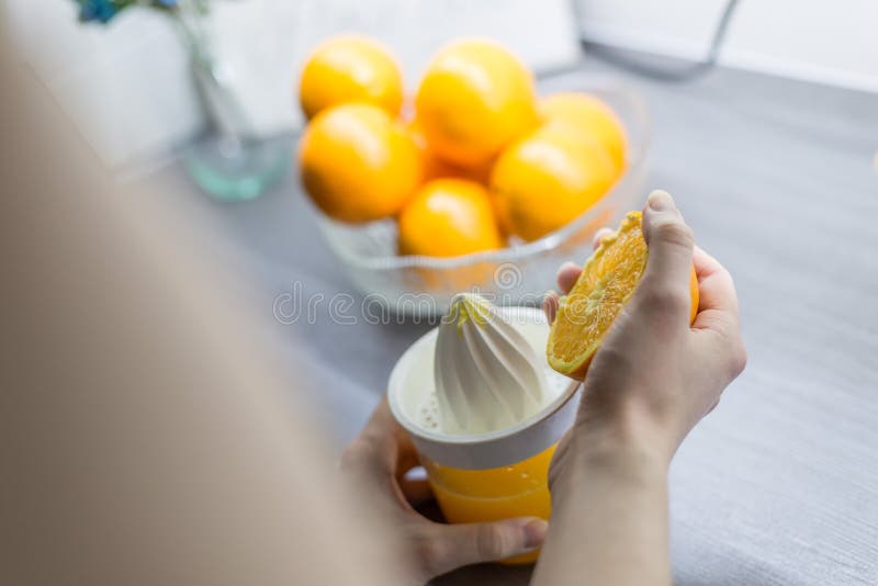 Squeezing Orange Juice by Hand Stock Image - Image of juice, glass ...
