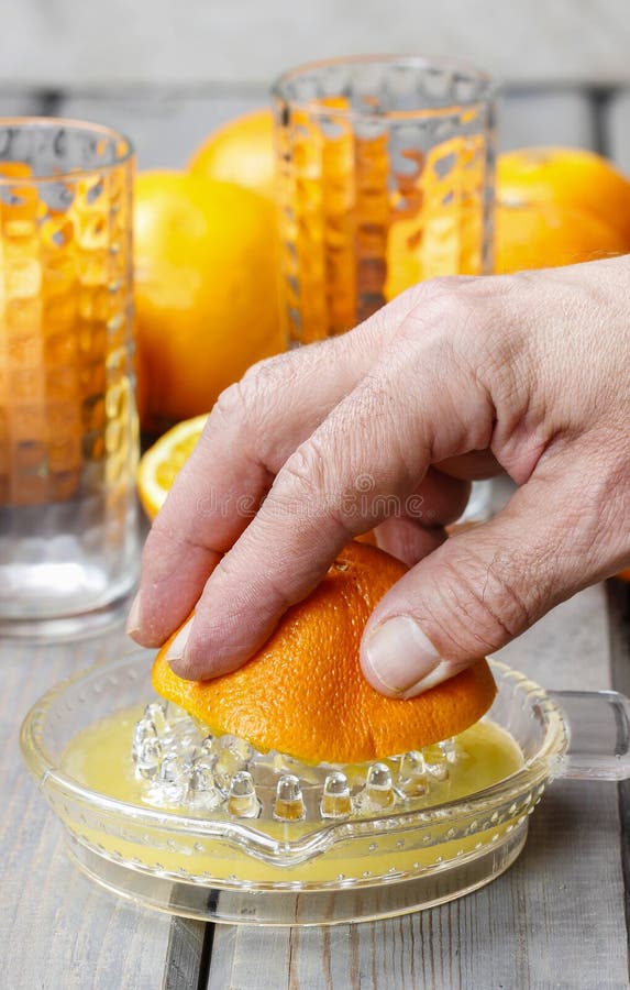 Squeezing oranges stock photo. Image of juice, juicer - 38258628