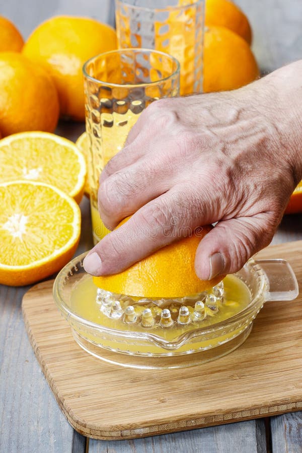 Squeezing oranges stock photo. Image of juice, household - 38258656