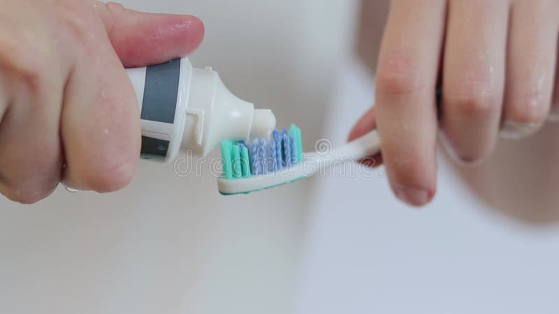 Squeezing Toothpaste on a Toothbrush, Close-up. Brush Your Teeth Stock ...