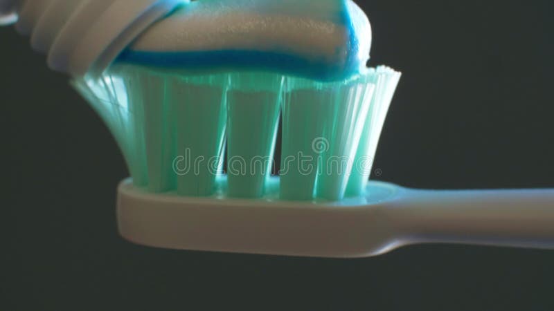 Squeezing Toothpaste from Tube Onto Toothbrush Stock Video - Video of ...