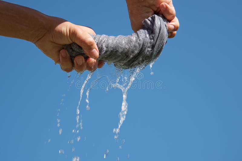 Squeezing of wet fabric. stock photo. Image of drop, water - 57836114