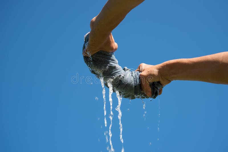 Squeezing of wet fabric. stock image. Image of nature - 60674527