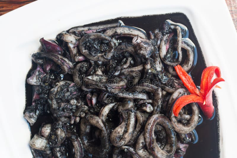 Squid in ink stock image. Image of seafood, ingredient - 64965015