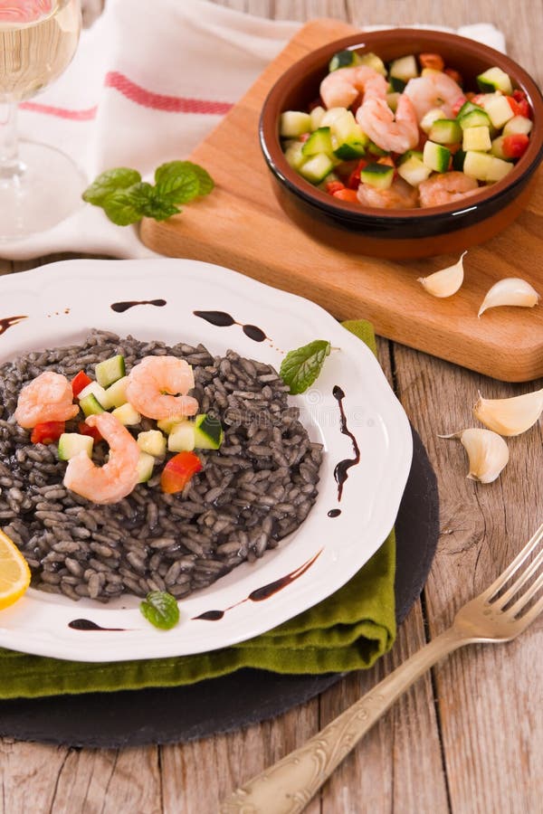 Squid ink risotto. stock photo. Image of delicious, chopped - 169617594
