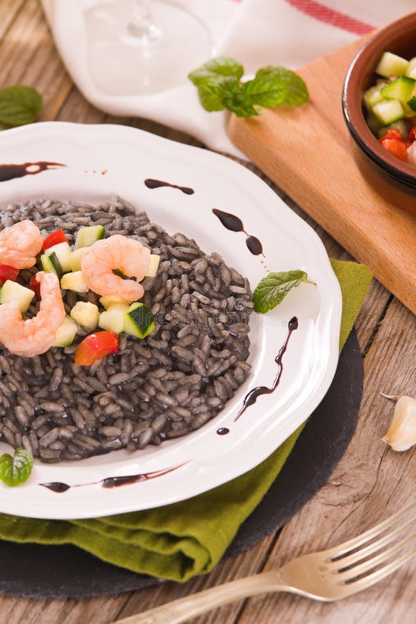 Squid ink risotto. stock photo. Image of oliveoil, lemon - 176624798