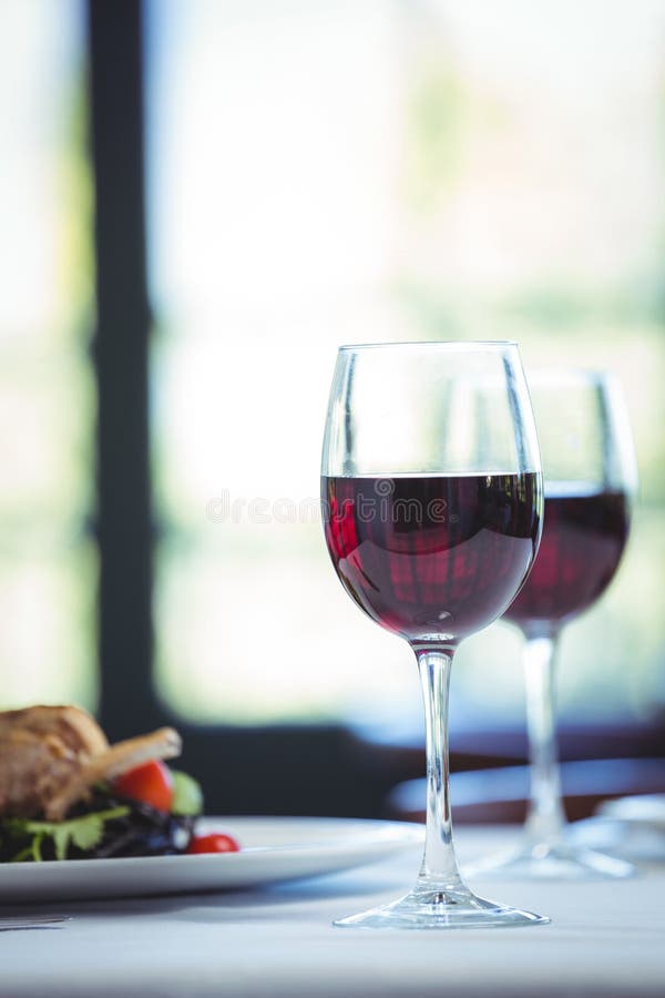 Squid Ink Spaghetti Dish with Basil for Two with Glasses of Red Wine ...