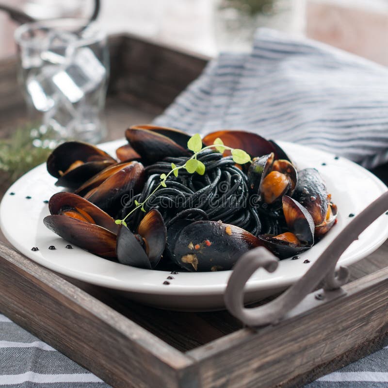 Squid Ink Spaghetti Pasta with Mussels Stock Photo - Image of dinner ...