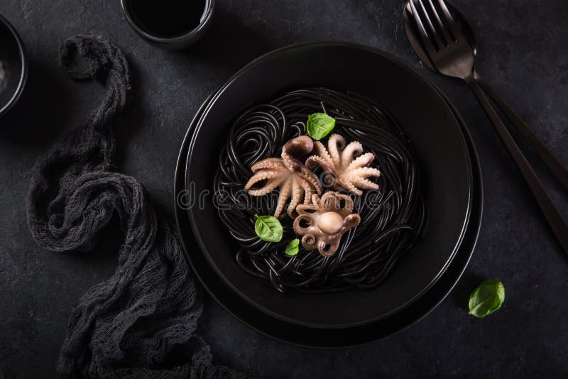 Black Squid Ink Spaghetti Pasta with Octopuses in Black Bowl Stock ...