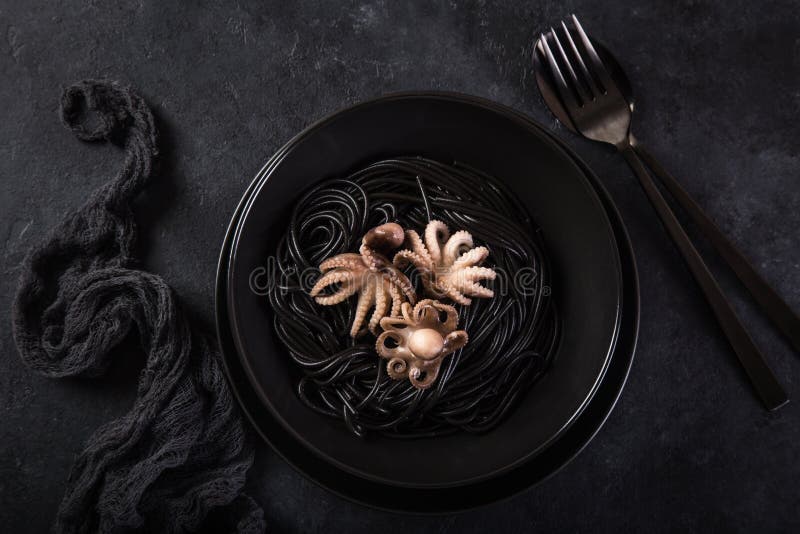 Squid Ink Spaghetti Pasta with Octopuses in Black Bowl Stock Image ...