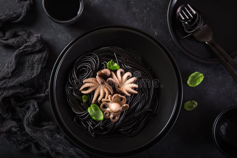 Black Squid Ink Spaghetti Pasta with Octopuses in Black Bowl Stock ...
