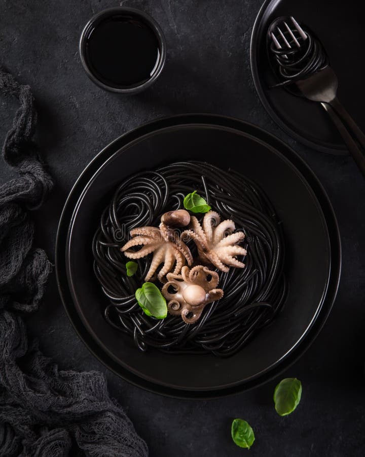 Squid Ink Spaghetti Pasta with Octopuses in Black Bowl Stock Image ...