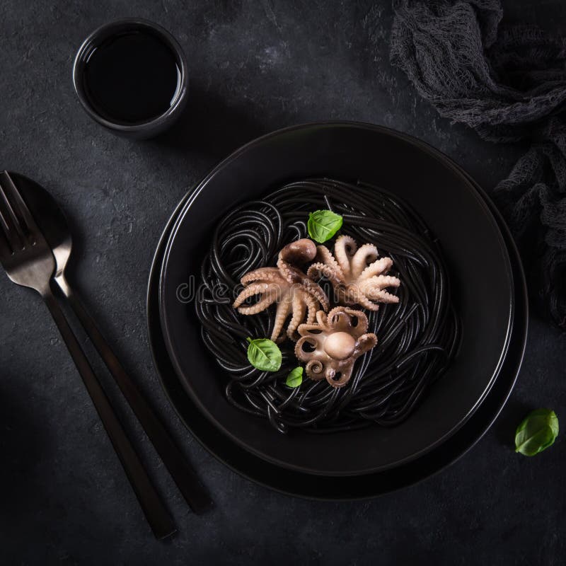 Squid Ink Spaghetti Pasta with Octopuses in Black Bowl Stock Image ...