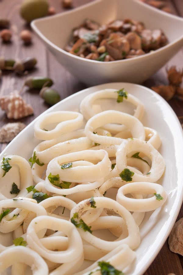 Squid rings and mushroom stock photo. Image of shells - 26206400