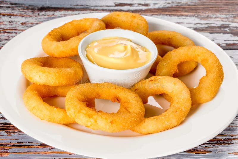 Squid Rings with Sauce on a White Plate Shot Horizontally Stock Photo ...