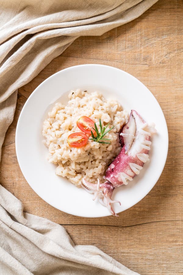 Squids or octopus risotto stock image. Image of color - 156453175