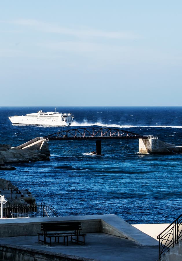 St. Elmo Breakwater Bridge editorial stock photo. Image of yacht - 96964413