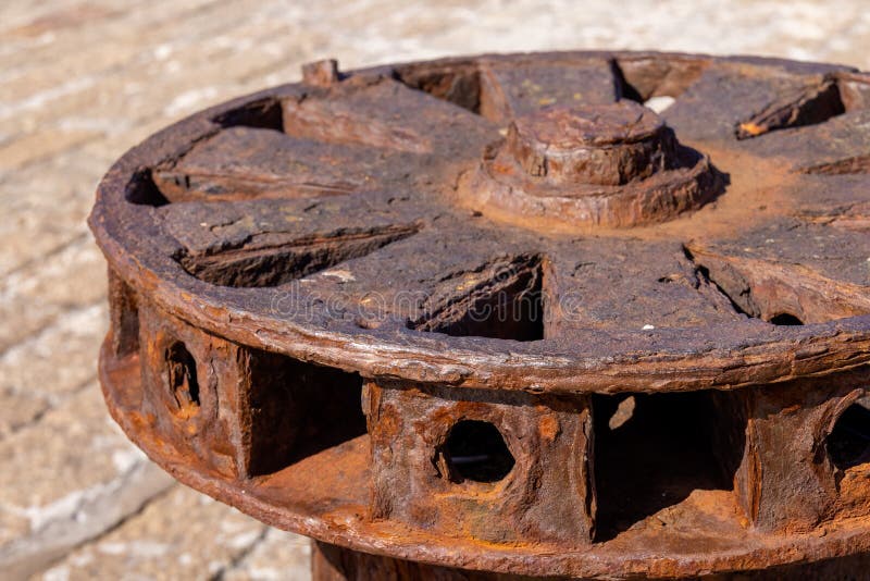 An Old Capstan with a Rusty Metal Chain Around it, Part of the ...