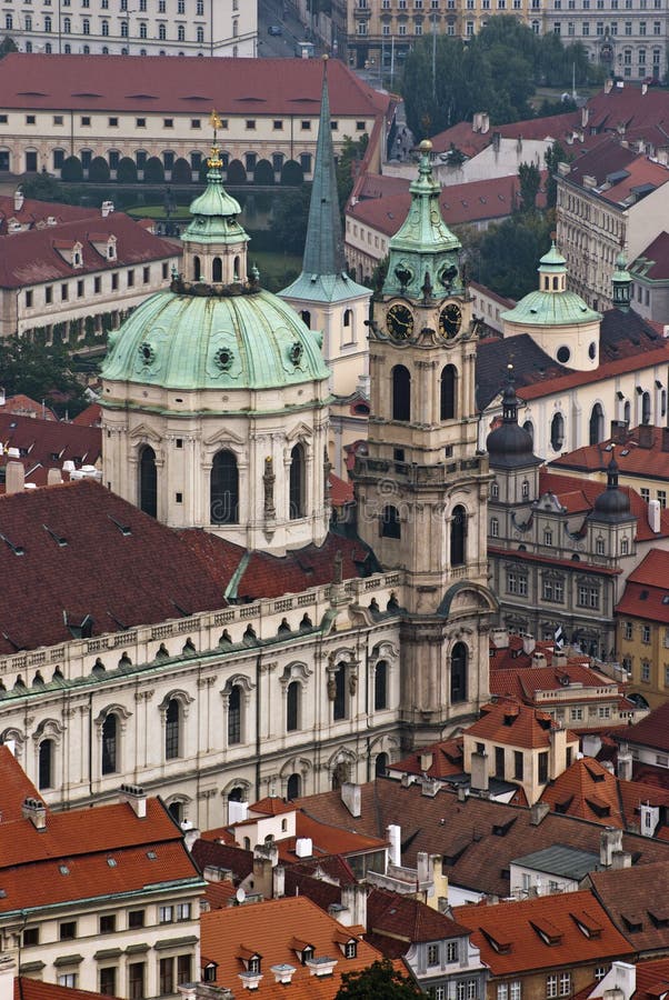 St. Nicholas Church and the Red Roofs in Prague Stock Photo - Image of ...