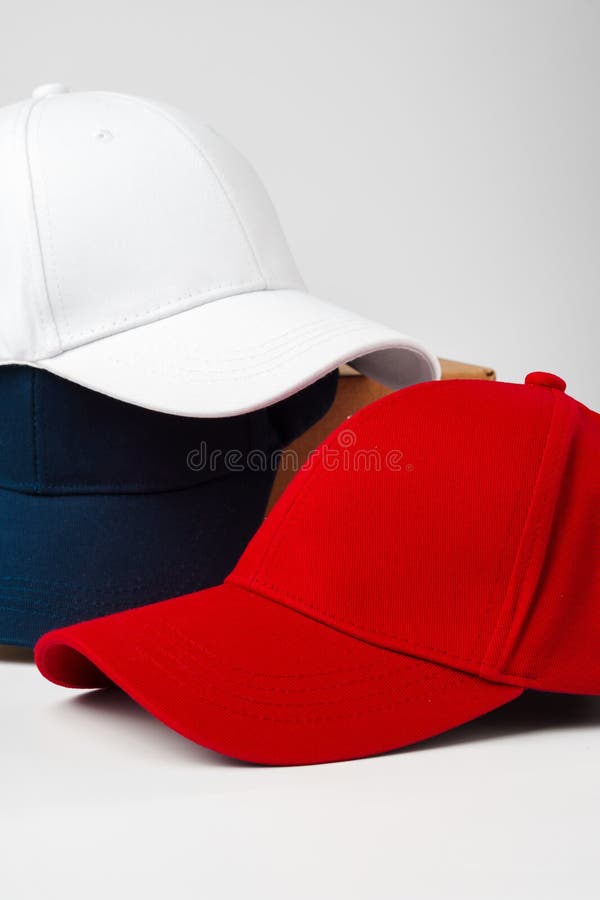 Stack of Assorted Baseball Caps on a White Background Stock Image ...