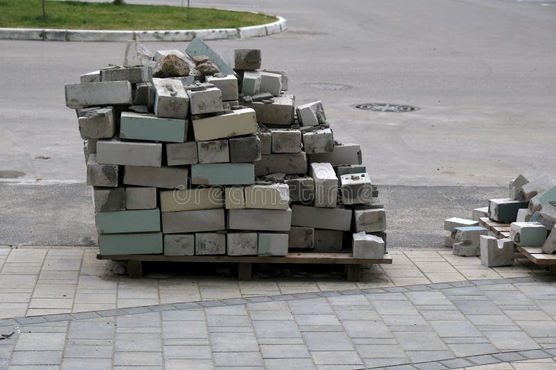 A Stack of Assorted Bricks on Pallets, Showcasing Different Colors ...