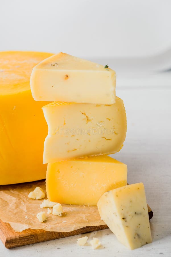 Stack of Assorted Cheeses Isolated on White Background Stock Photo ...