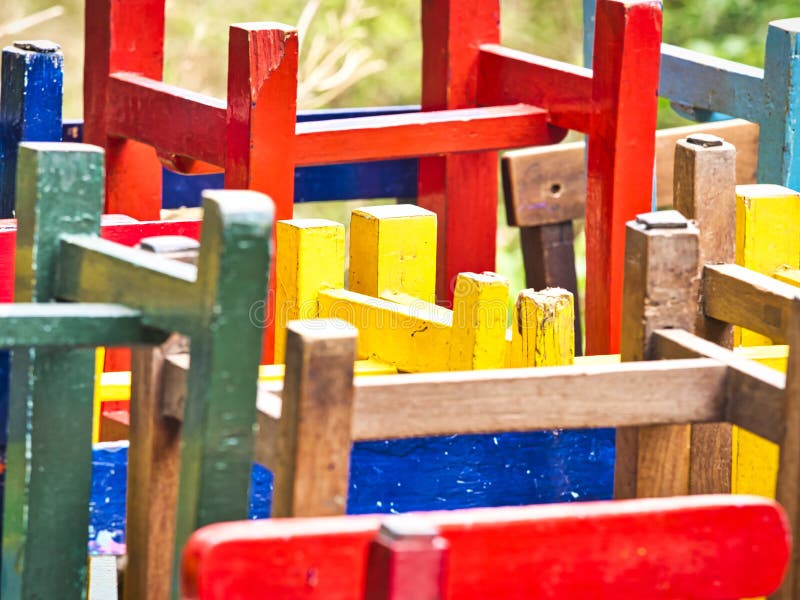 Stack of Assorted Colored Wooden Chairs in Random Disarray, Full Frame ...
