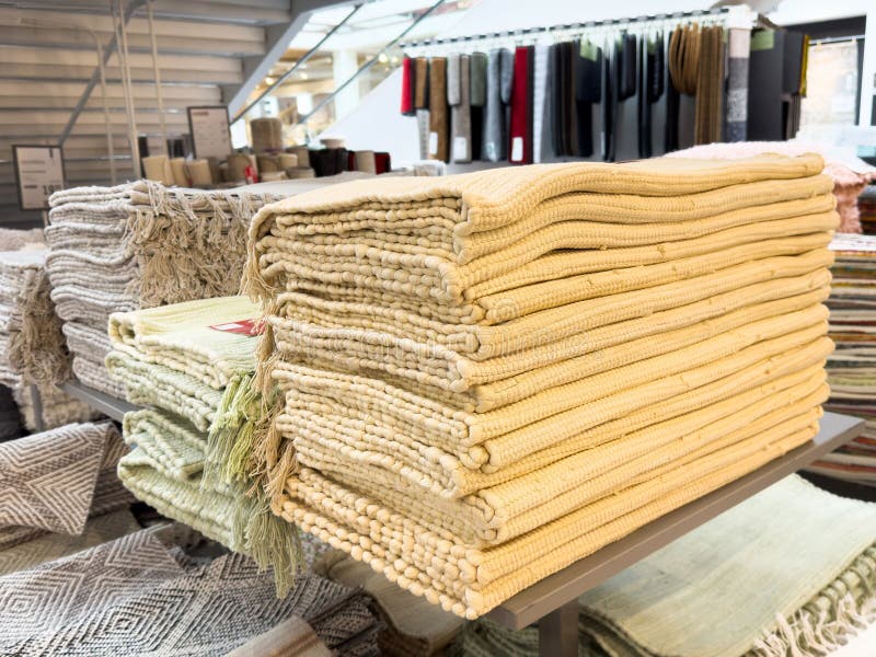 Stack of Assorted Rugs Displayed in Home Decor Store Editorial Photo ...