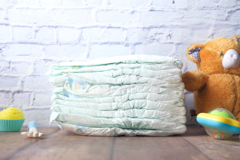 Stack of Baby Diaper on Table, Stock Photo - Image of supply, hygiene ...