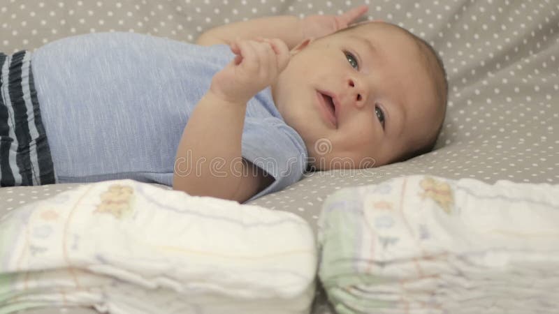 Baby Stack Many Diapers on Bed Woman Mother Hand Taking One Stock Video ...