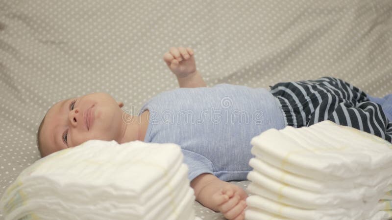 Baby Stack Many Diapers on Bed Woman Mother Hand Taking One Stock Video ...