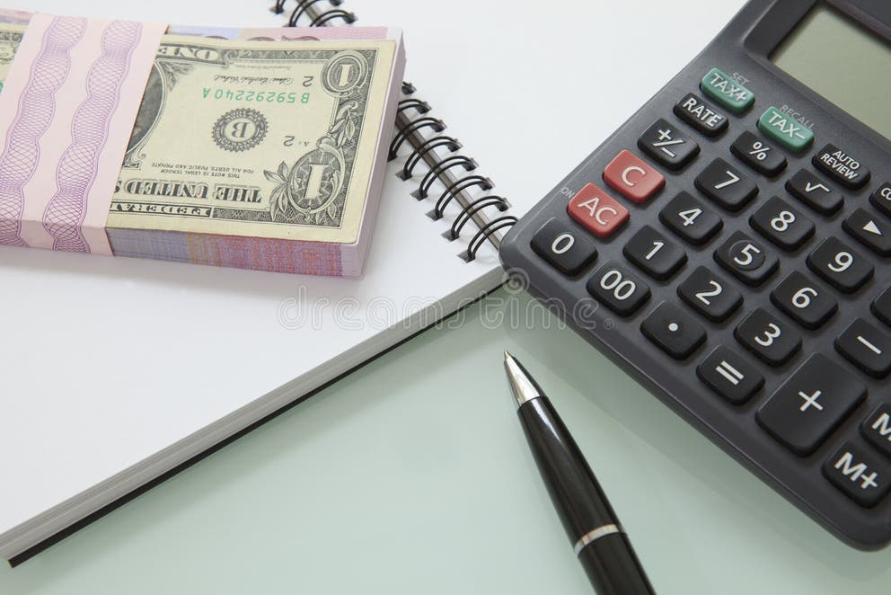 Stack of Bank Note and Pen Calculater on Note Book Stock Photo - Image ...
