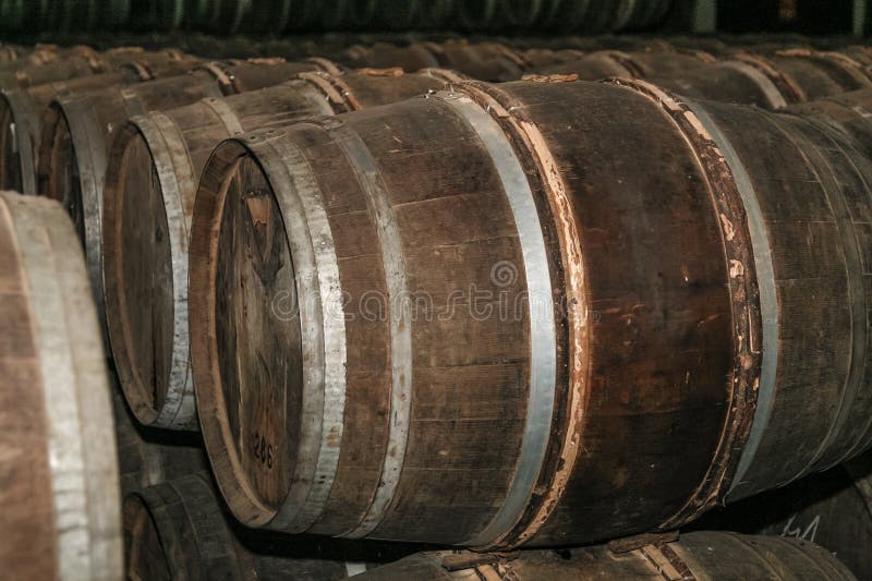 A Stack of Barrels with the Top Barrel Being the Largest Stock Photo ...