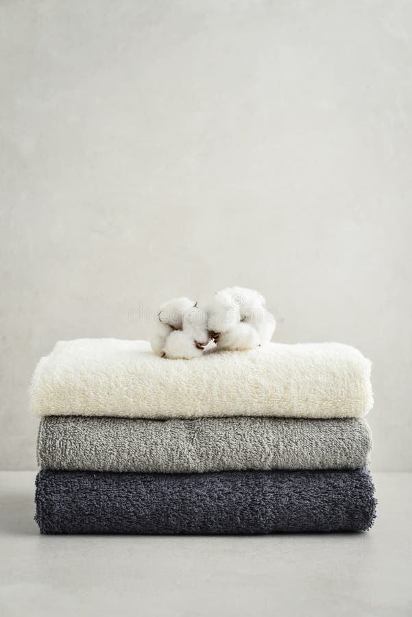 Stack of Bath Towels with Cotton Flowers Stock Photo - Image of hygiene ...