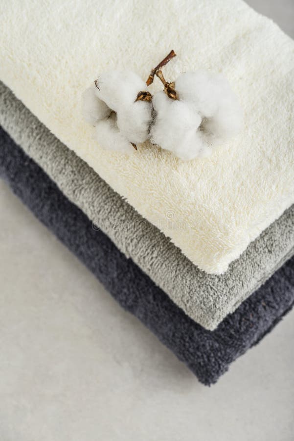 Stack of Bath Towels with Cotton Flowers Stock Image - Image of stacked ...