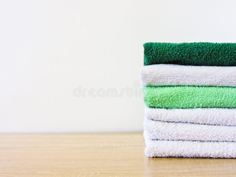 Stack of Bath Towels on Light Wooden Background Closeup.Pile of Rainbow ...