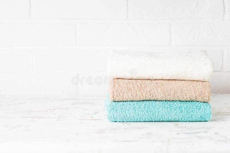 Stack of Bath Towels in White Bathroom. Stock Image - Image of ...