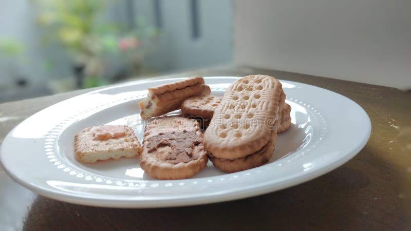 A Stack of Biscuits Filled with Chocolate and Orange Stock Image ...