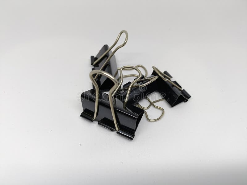 Pile of Black Binder Clips on White Background Stock Image - Image of ...