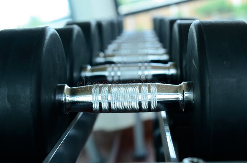 Stack of black dumbbells stock photo. Image of bodybuilding - 44229102