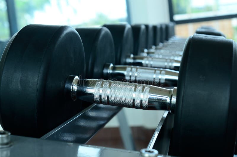 Stack of black dumbbells stock image. Image of muscle - 44229177