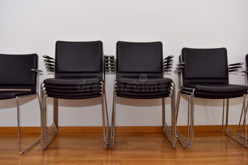 Stack of office chairs stock photo. Image of sitting - 272604266