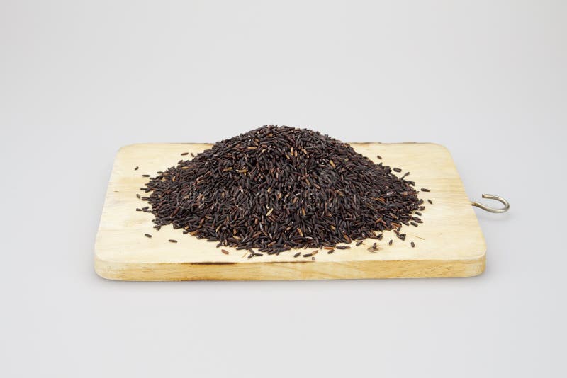 Stack of Black Rice Put on a Wooden Chopping Block Stock Photo - Image ...